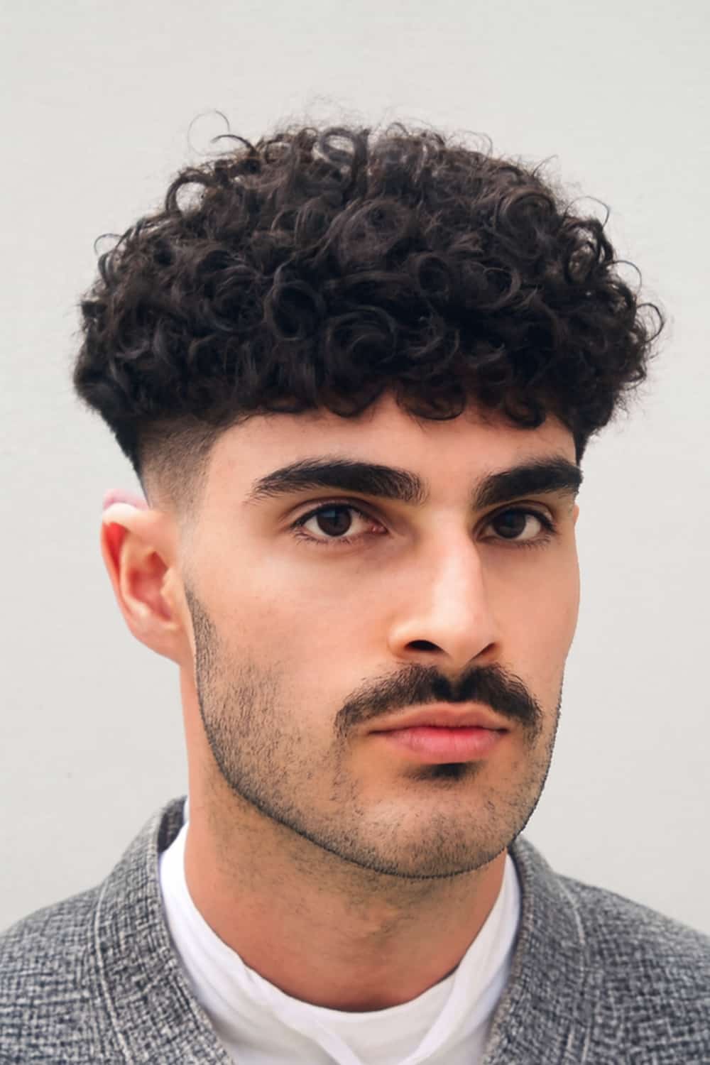 19 Best Low Taper Fade Fluffy Haircuts For 2025